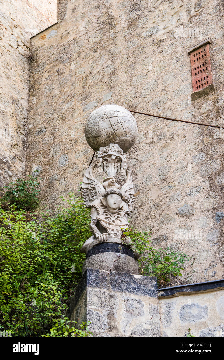 A Modern Harpy statue supports a globe Stock Photo - Alamy