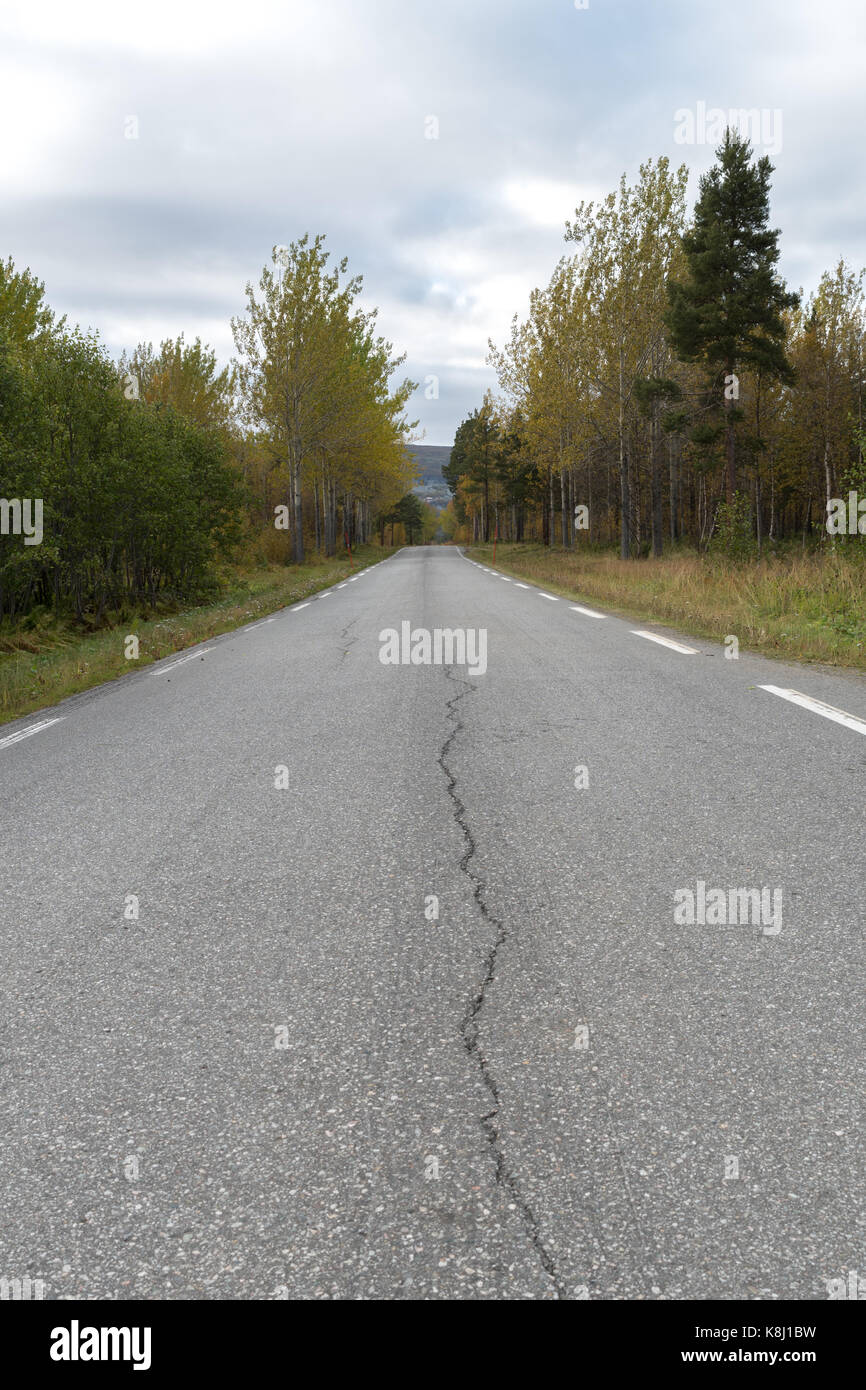 Abstract background, straight asphalt road with a crack Stock Photo - Alamy