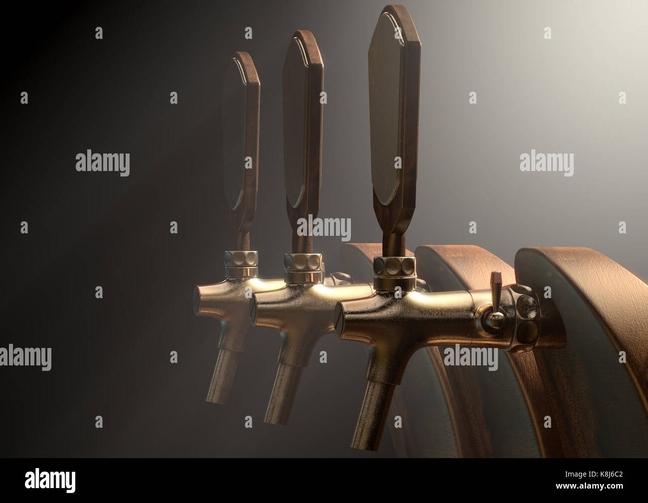 A row of wood and brass draught beer taps on an isolated dark moody ...