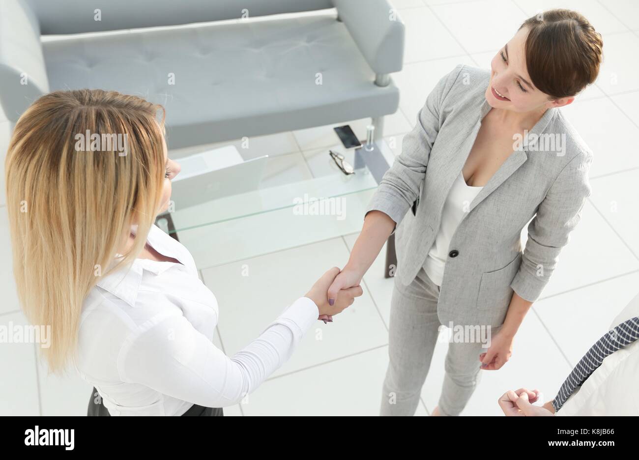view from the top.handshake of business partners upon meeting in the ...