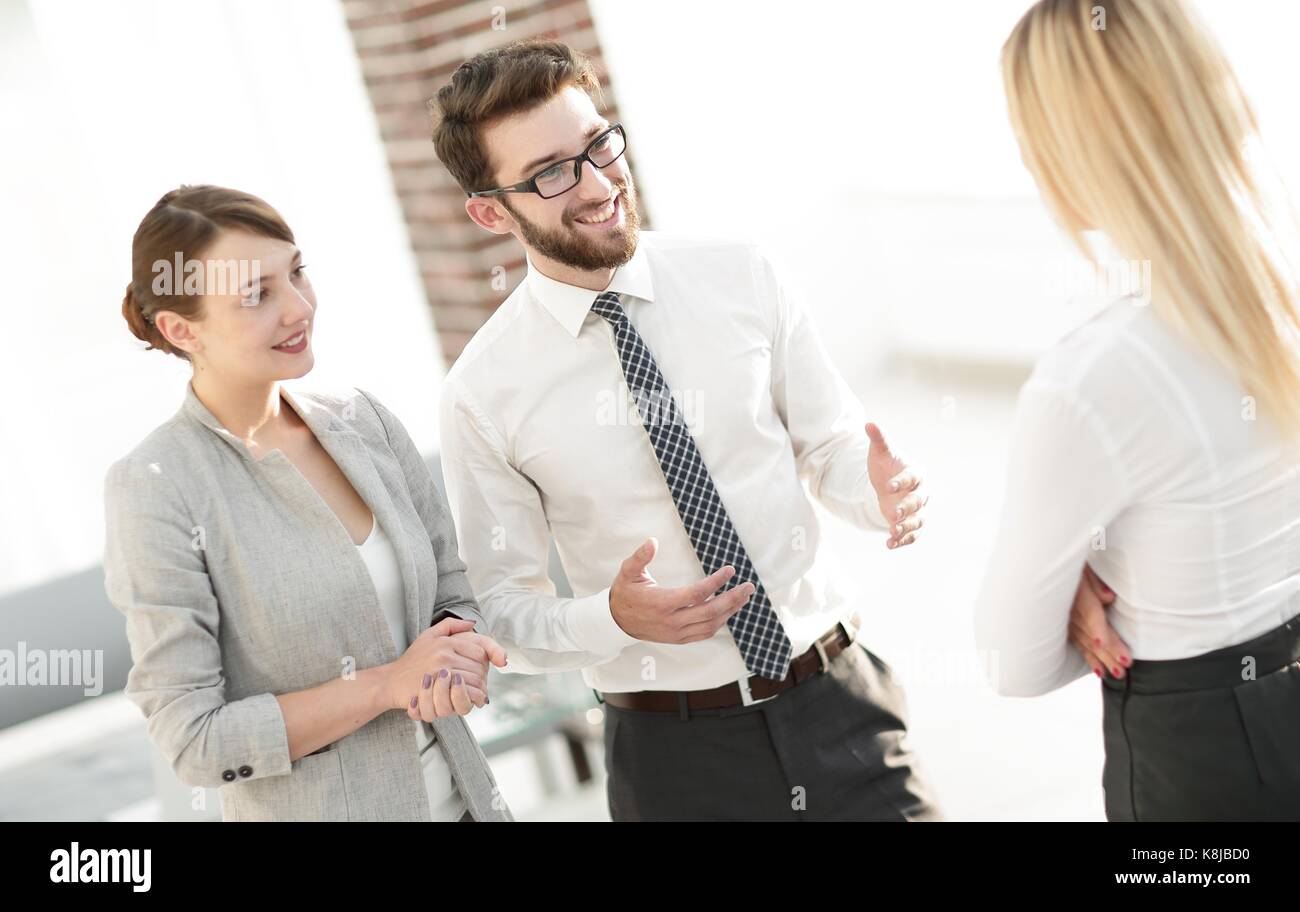 Manager and business team talking in the office Stock Photo - Alamy