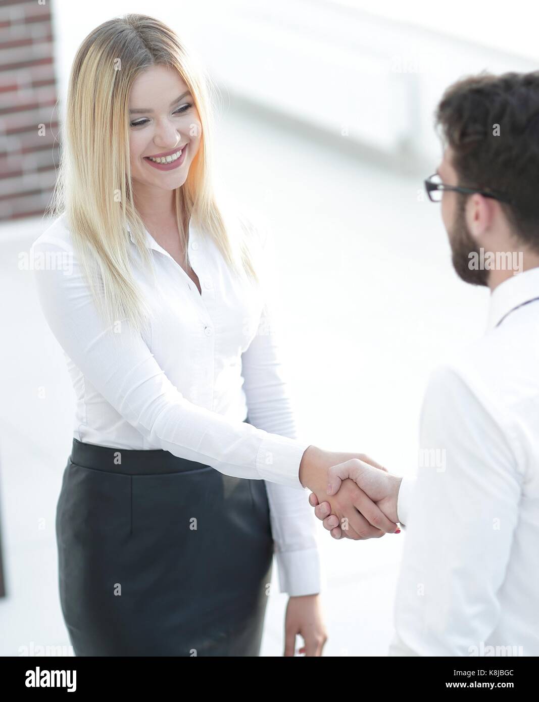 handshake business partners in the office Stock Photo - Alamy