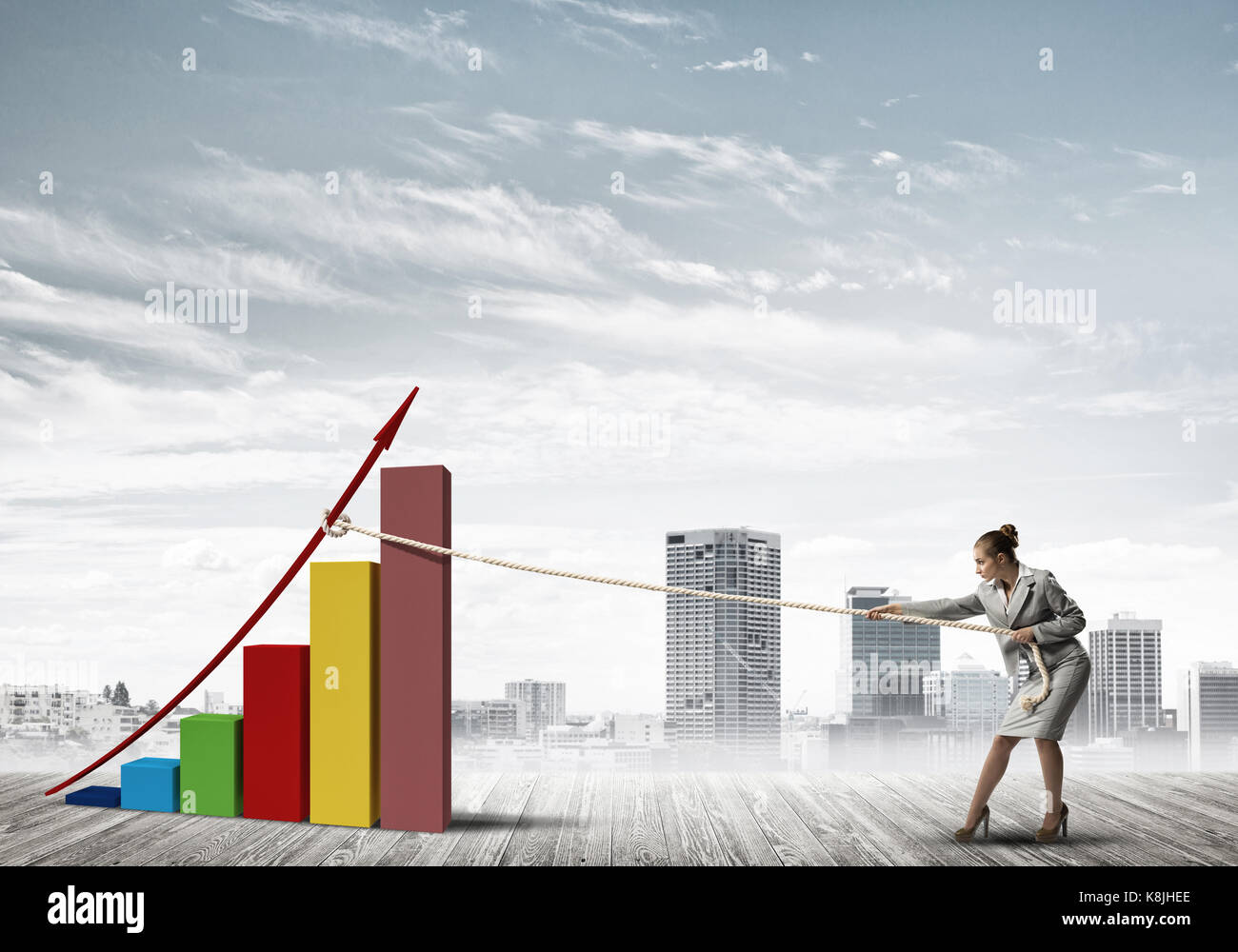 Businesswoman pulling graph with rope as concept of power and control ...
