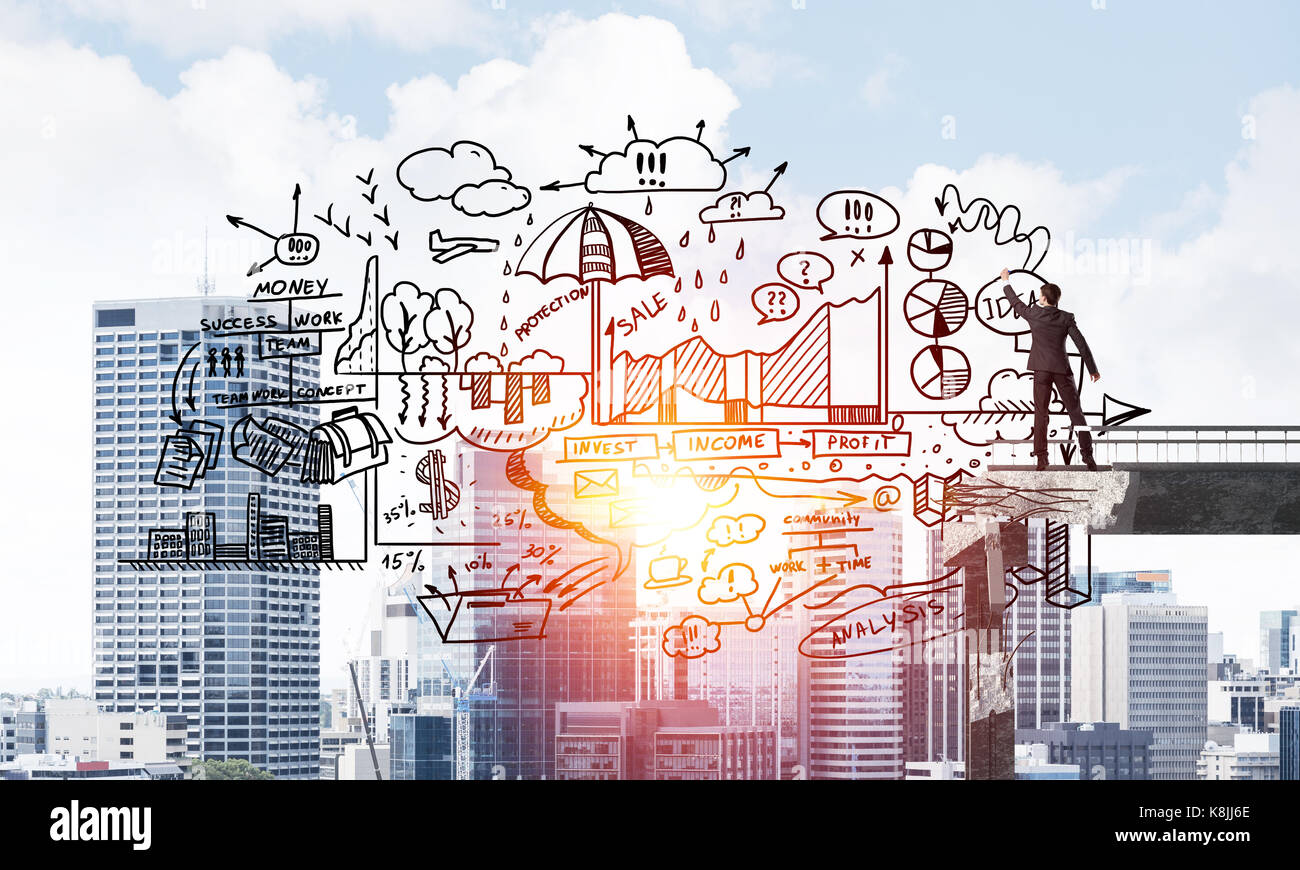 Businessman drawing business conceptual sketches Stock Photo - Alamy