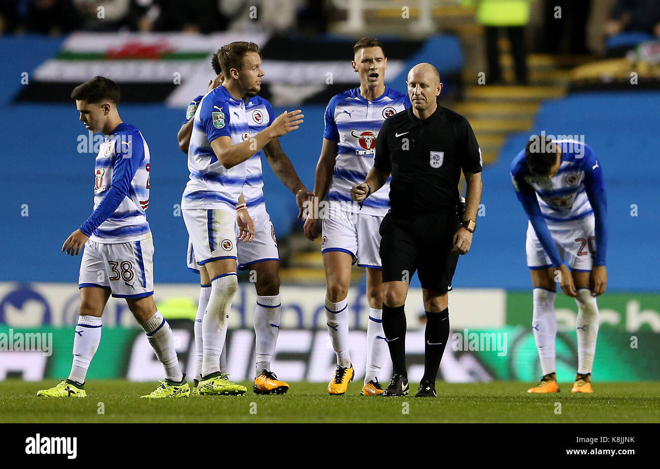 Referee Andy Davies is surrounded by Reading players after the second ...
