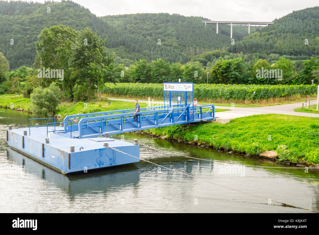 RIOL, GERMANY - 5TH Aug 17: Two passengers waits patiently for a ferry ...