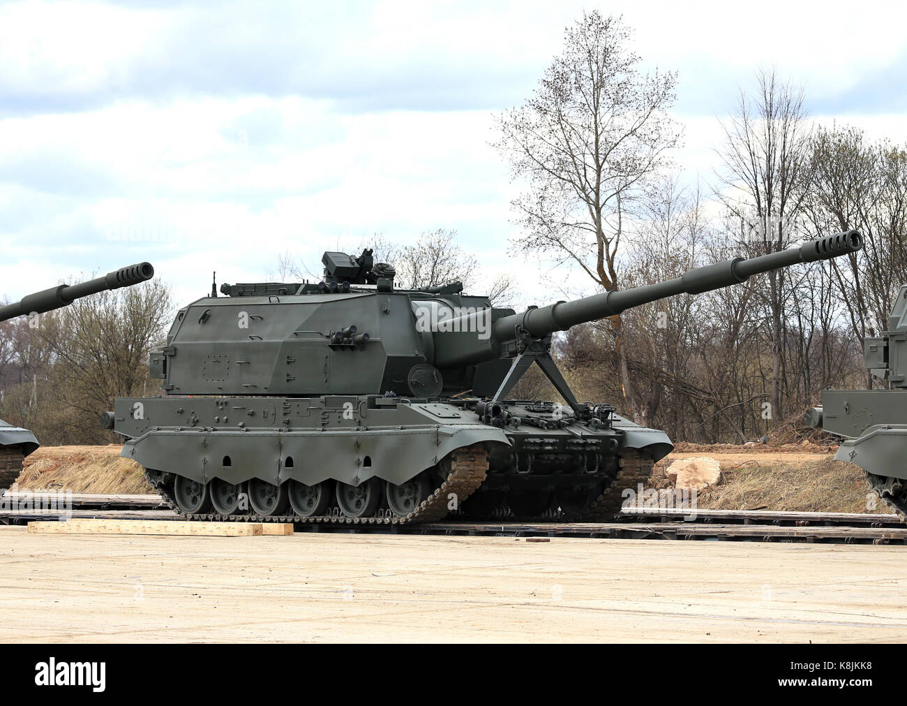 152 mm self-propelled howitzer on crawler tracks on a railway platform ...
