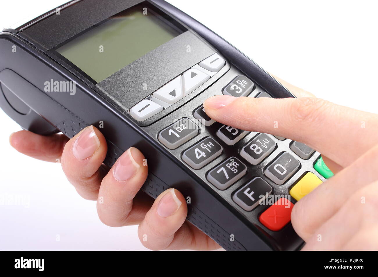 Hand of woman using payment terminal, enter personal identification ...