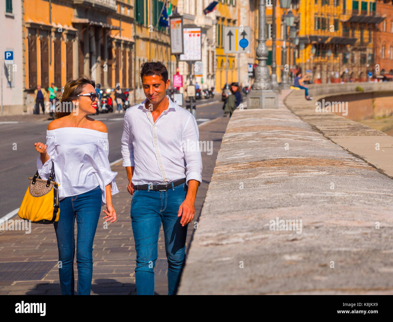 Beautiful couple walk at River Arno in Pisa - PISA TUSCANY ITALY ...