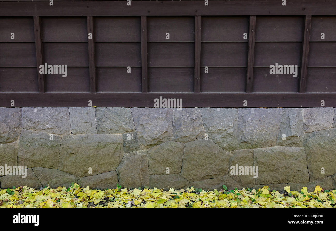 Stone and wooden wall of old castle at autumn in Tokyo, Japan Stock ...