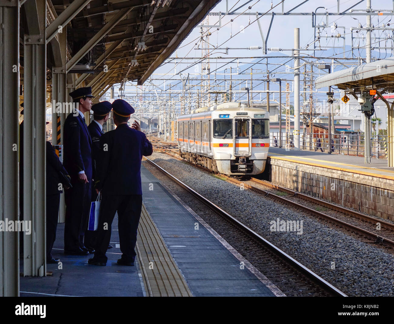 Tokyo, Japan - Dec 25, 2015. JR staffs standing at railway station in ...