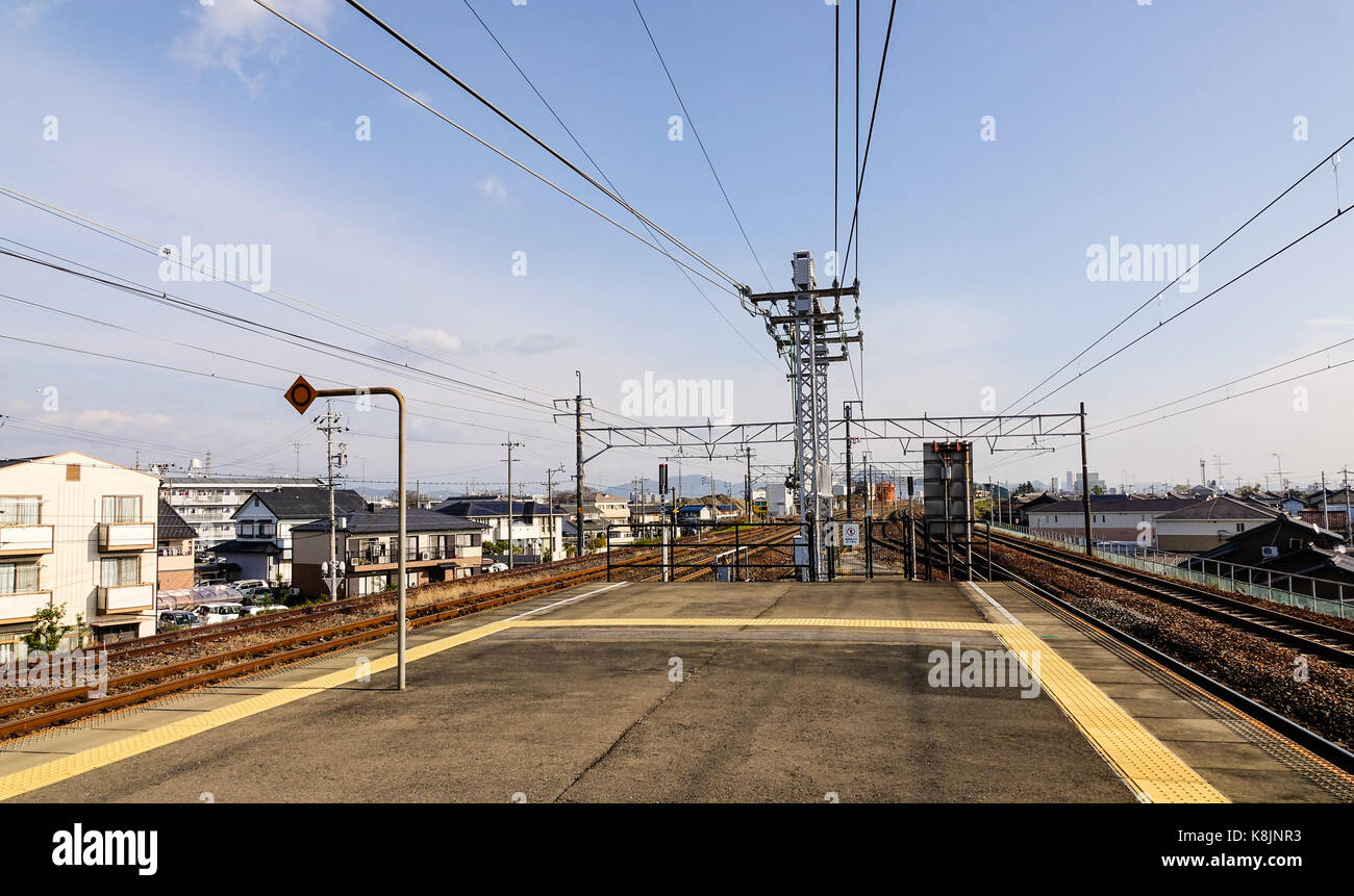 Tokyo, Japan - Dec 25, 2015. Platform with the tracks at railway ...