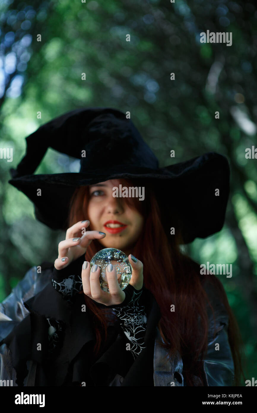 Photo of witch with magic ball Stock Photo - Alamy