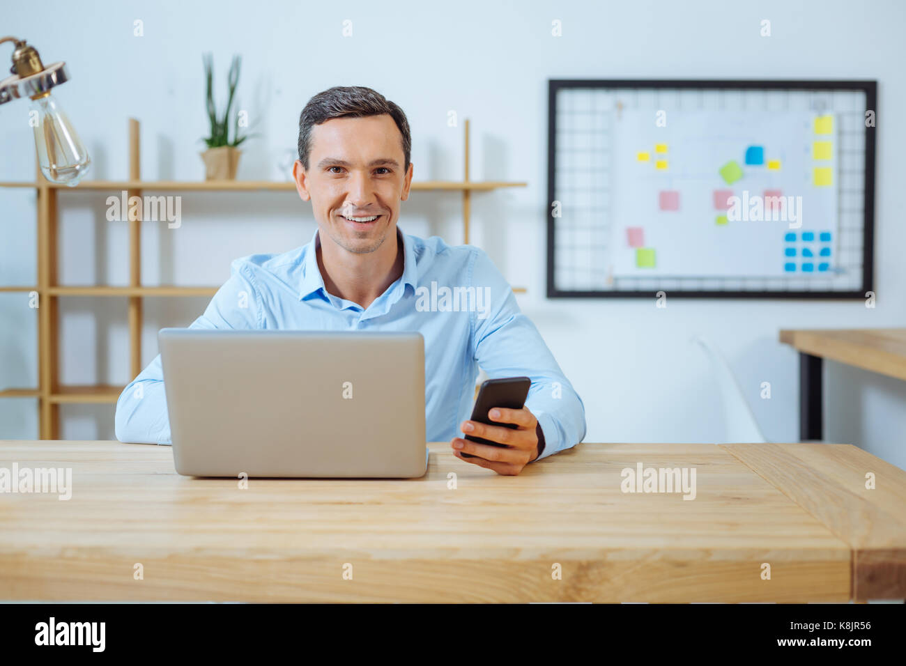 Happy man working in the office Stock Photo - Alamy