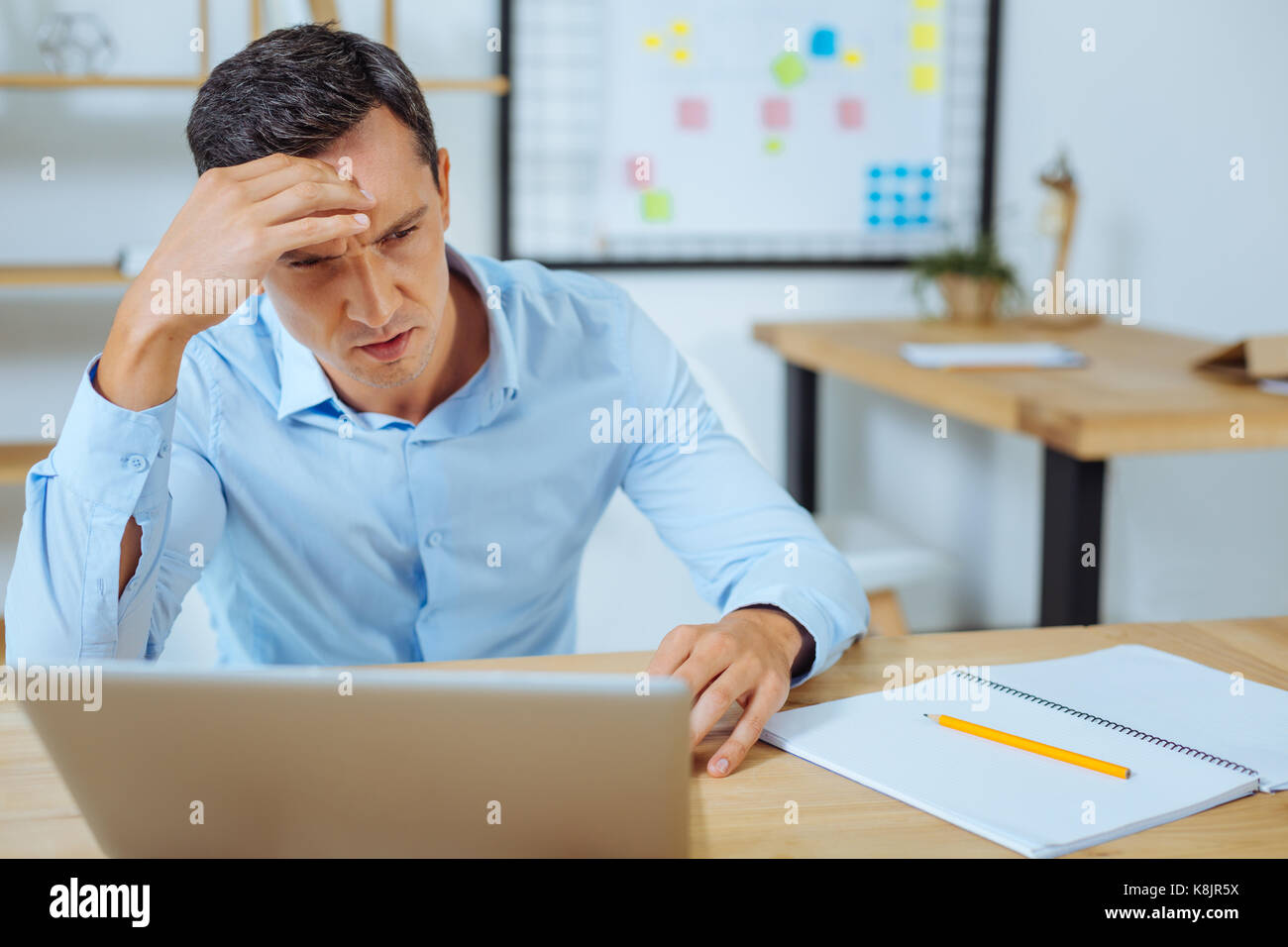 Serious male person having some thoughts Stock Photo - Alamy