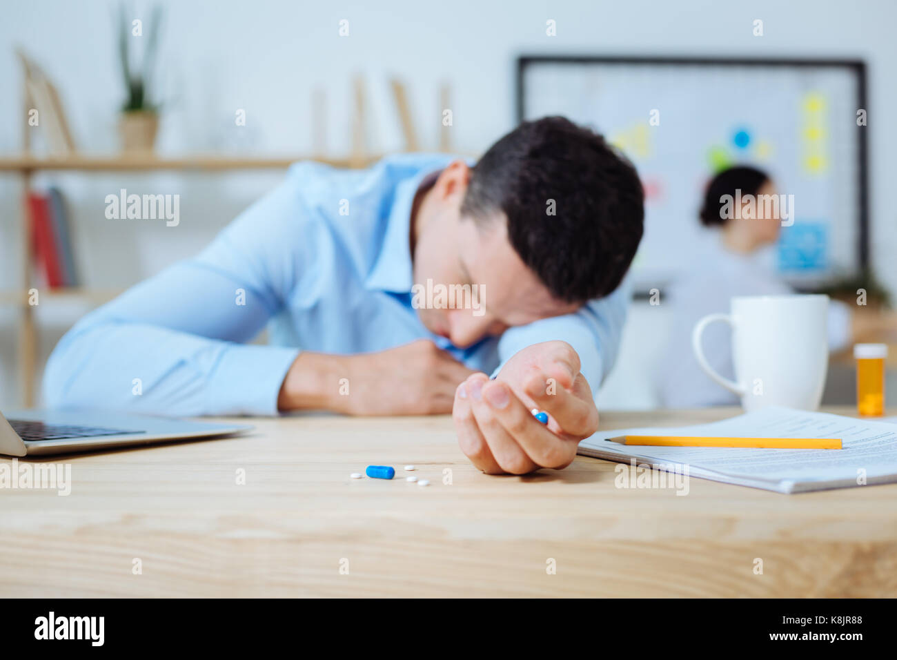 Tired male person lying on his arm Stock Photo - Alamy