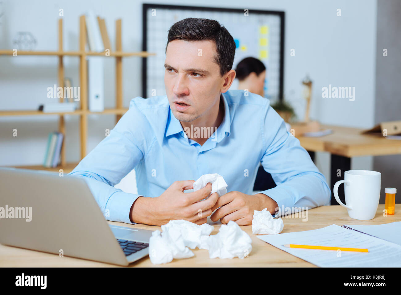 Serious office worker feeling very bad Stock Photo - Alamy