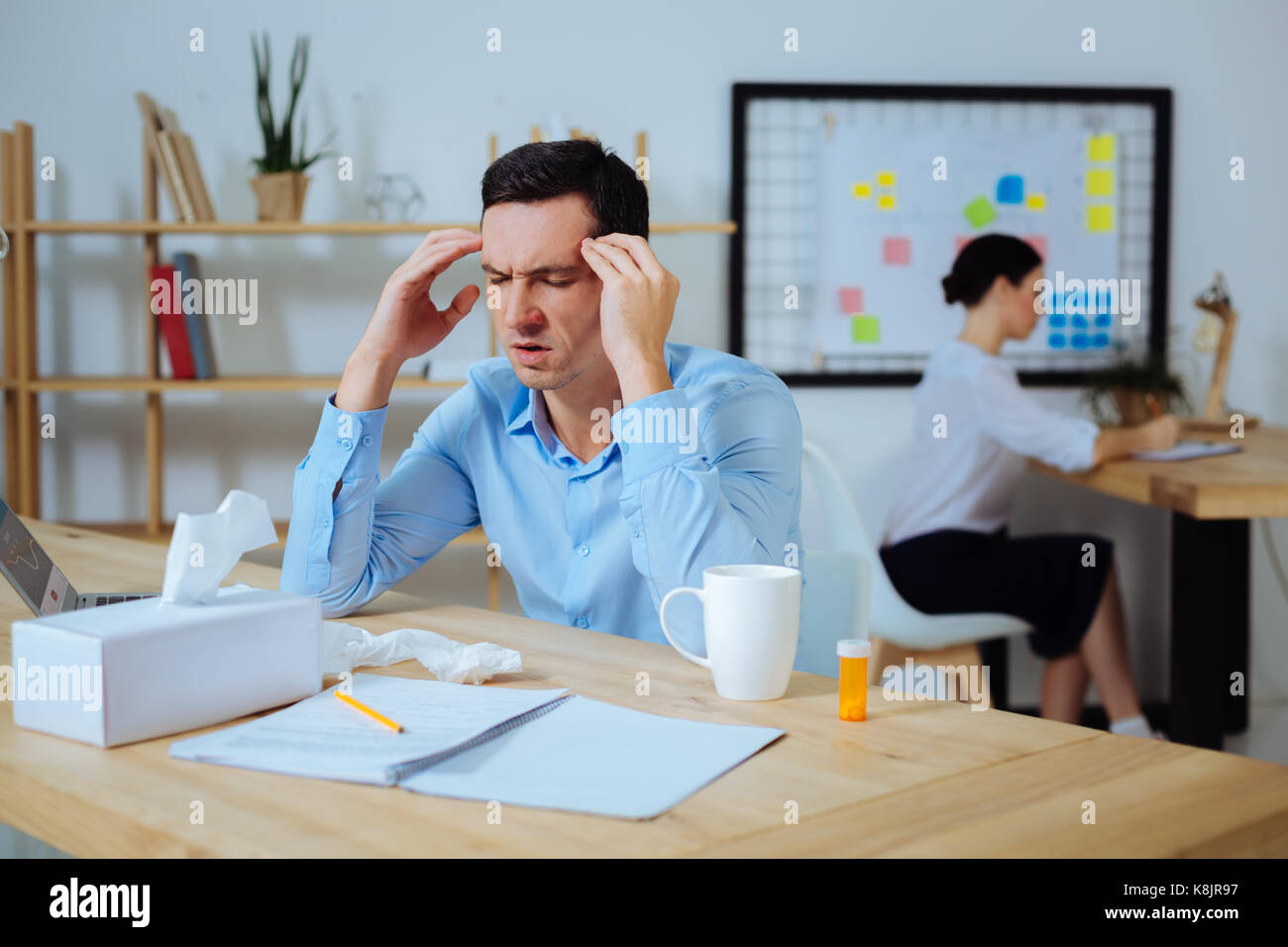 Serious brunette man trying to concentrate Stock Photo - Alamy