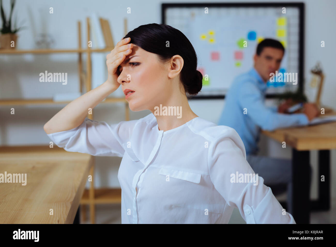 Portrait of serious woman that being deep in thoughts Stock Photo - Alamy