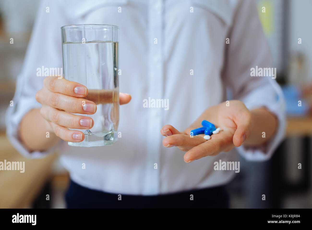 Close up of female that going to take medicine Stock Photo - Alamy