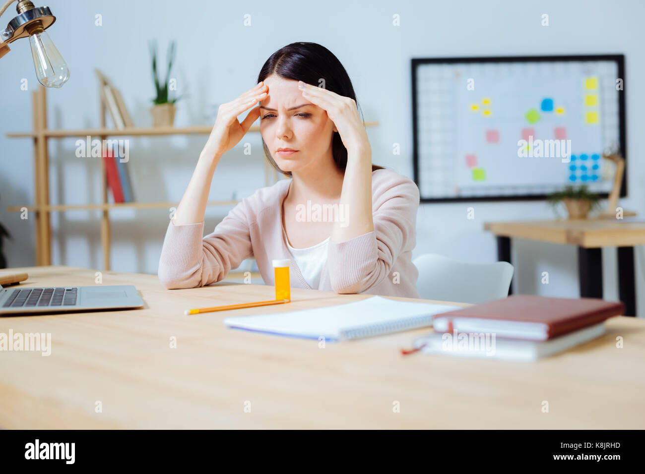Attentive office worker having some thoughts Stock Photo - Alamy