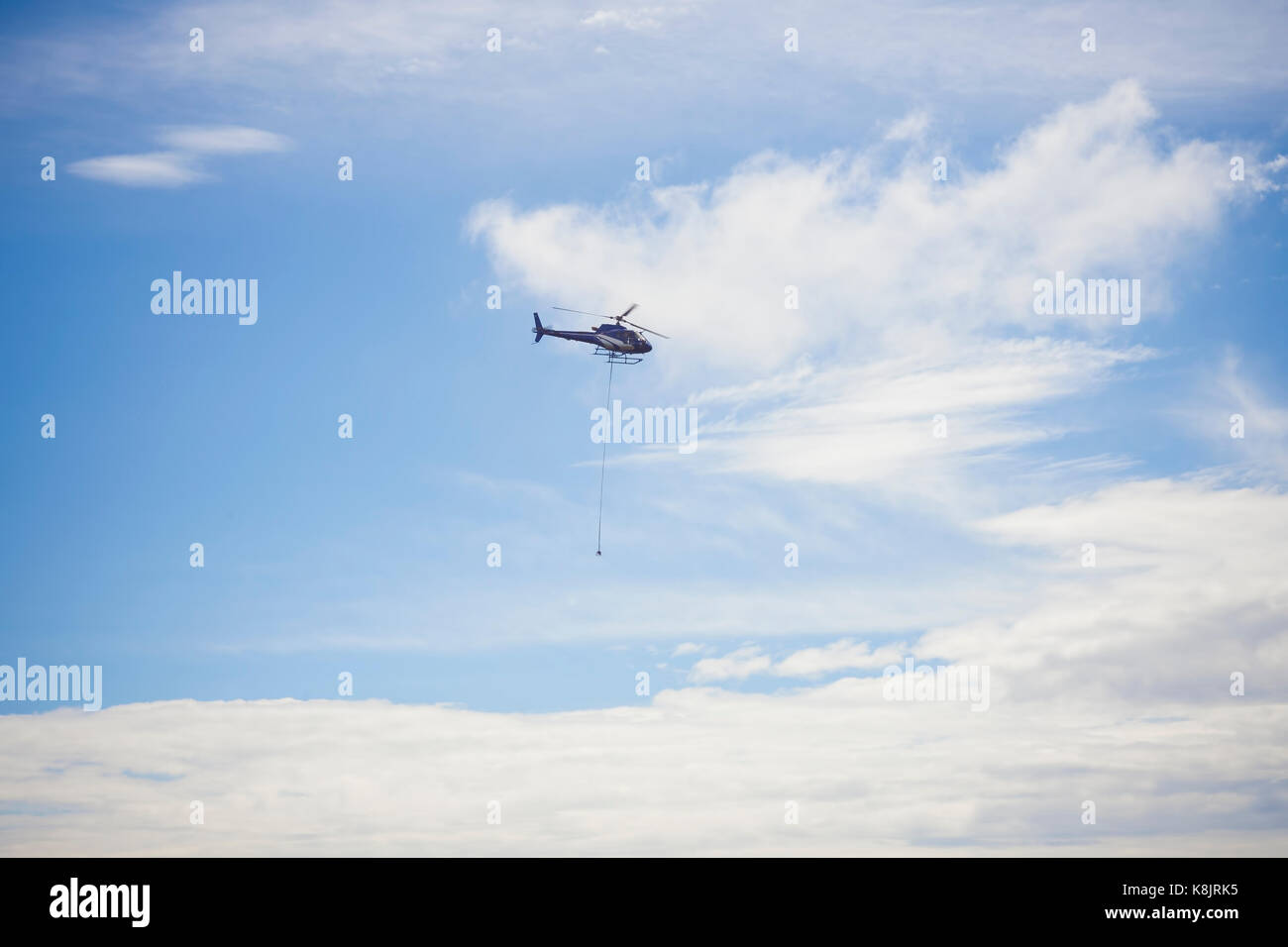 helicopter carry cargo in the sky Stock Photo - Alamy