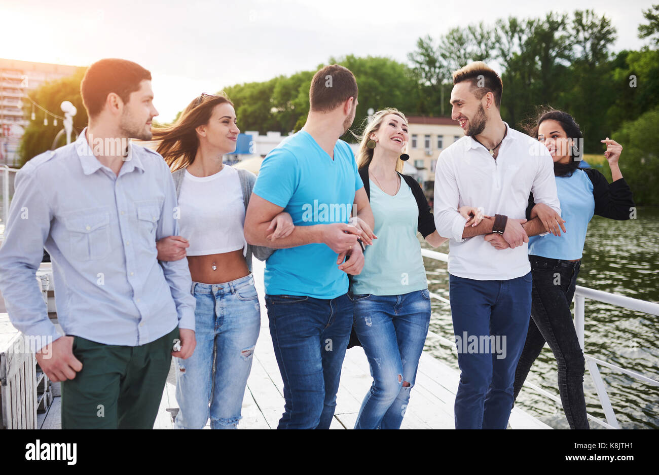 Girls sitting on dock hi-res stock photography and images - Alamy