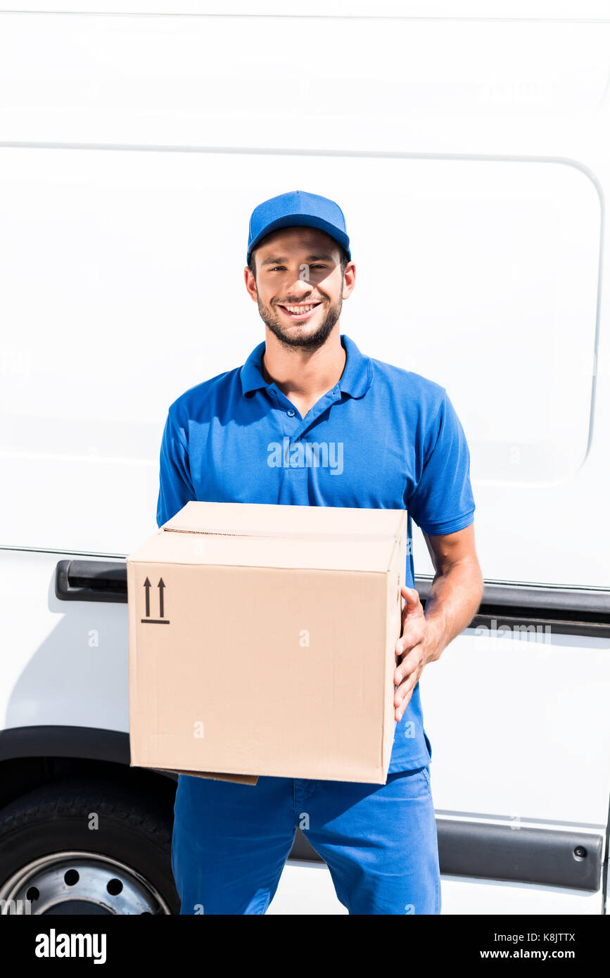 delivery man with box Stock Photo - Alamy