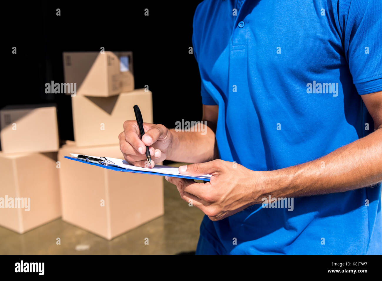 delivery man with documents Stock Photo - Alamy