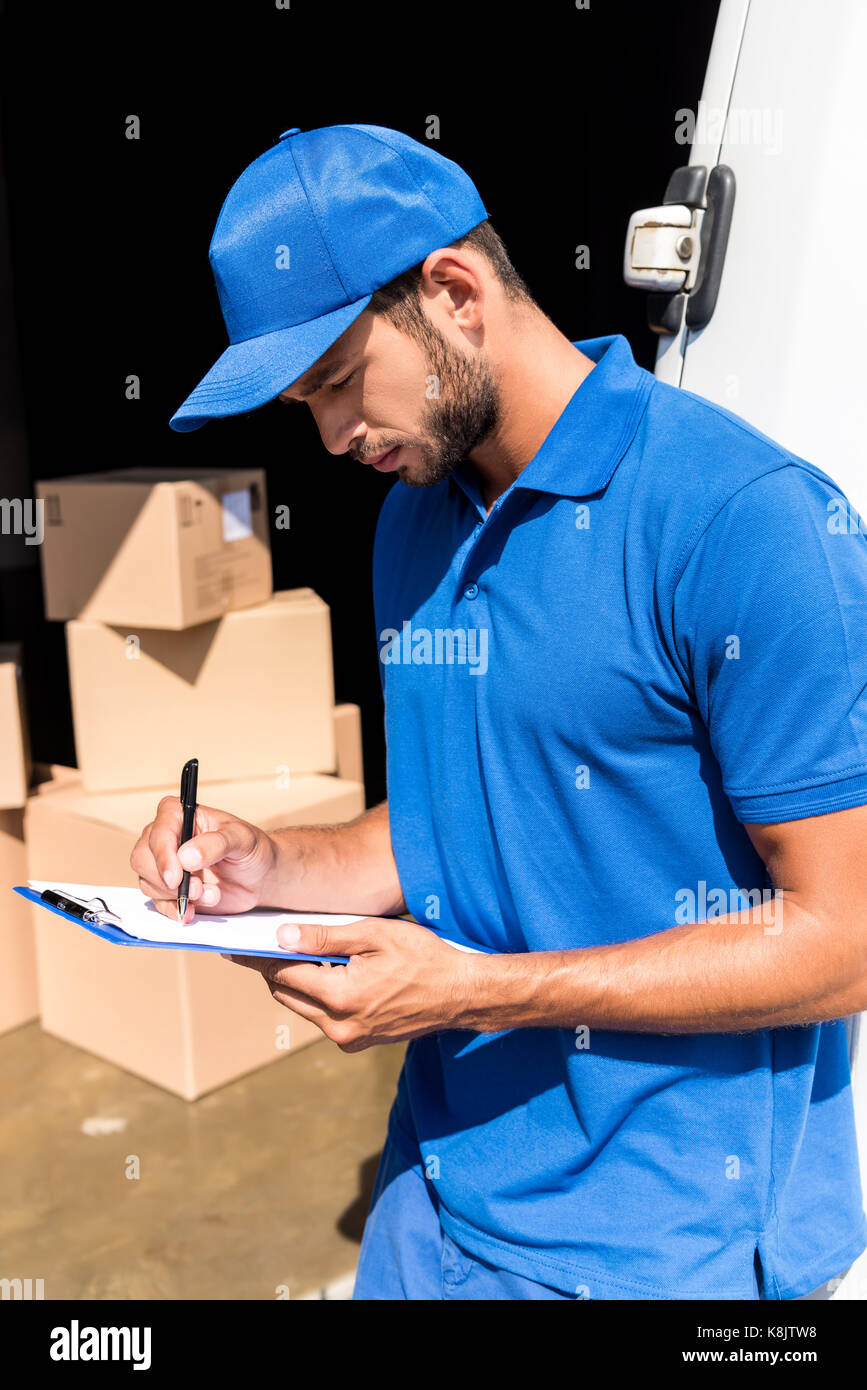 delivery man with documents Stock Photo - Alamy