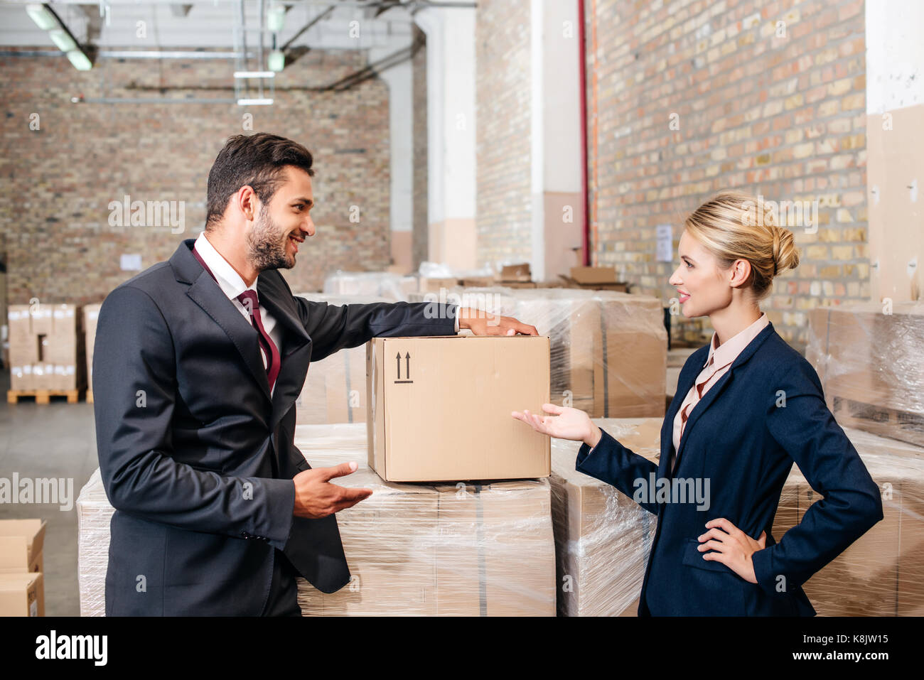business colleagues talking at warehouse Stock Photo - Alamy