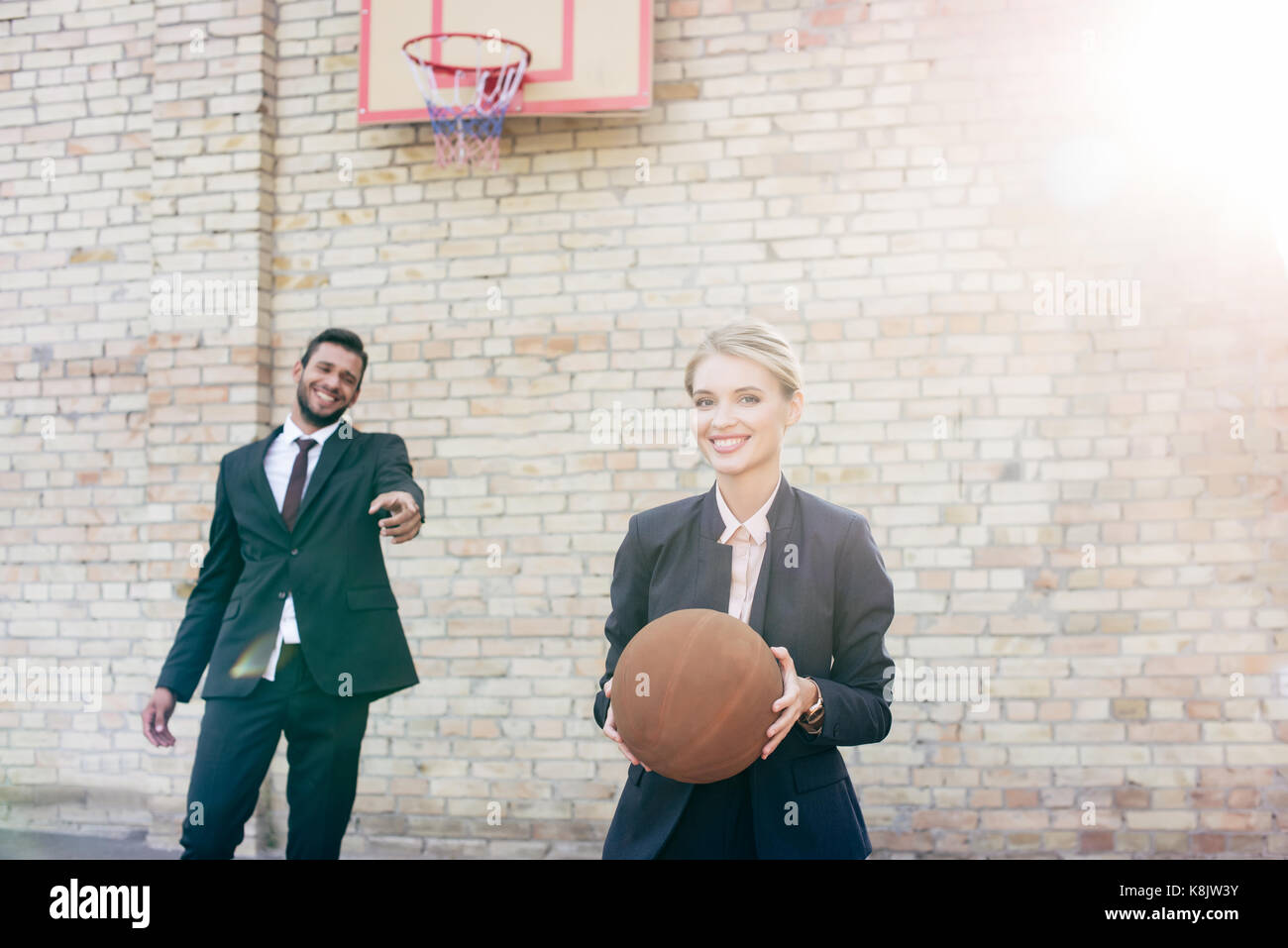 business colleagues with basketball ball Stock Photo - Alamy