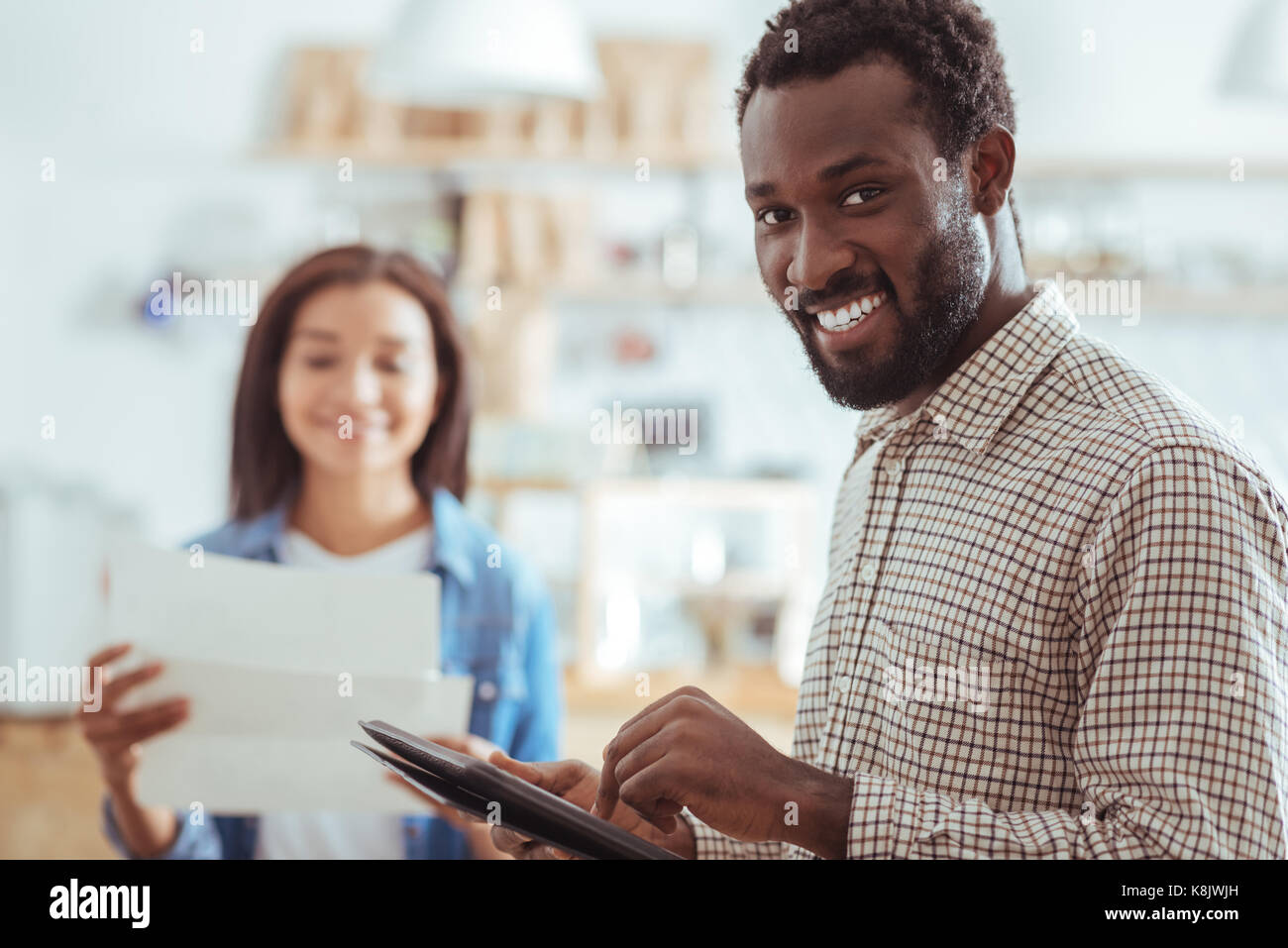Upbeat man revising speech for startup presentation Stock Photo - Alamy