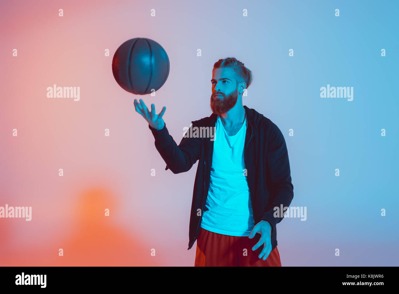 young man with basketball ball Stock Photo - Alamy