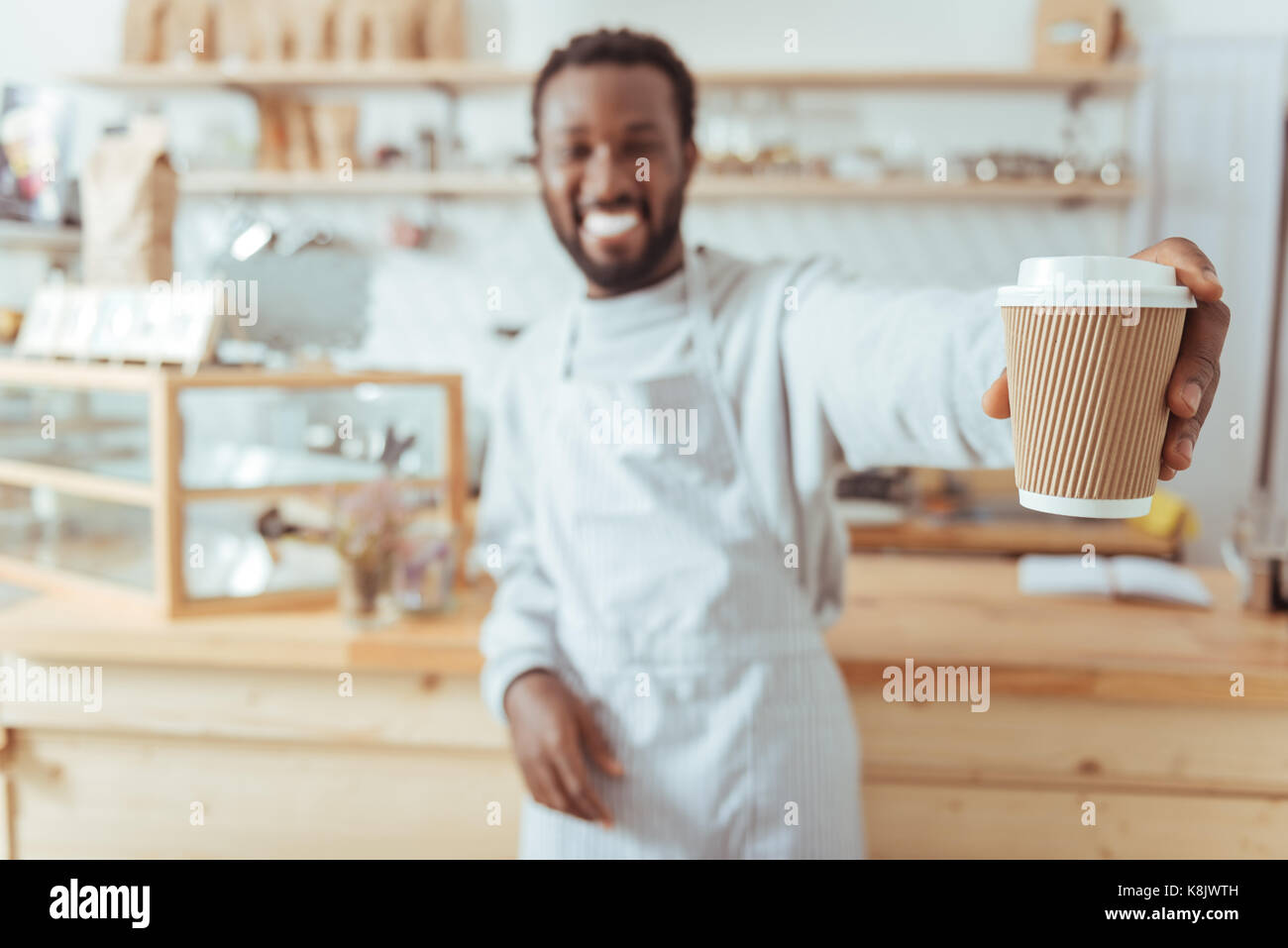 Handing coffee hi-res stock photography and images - Alamy