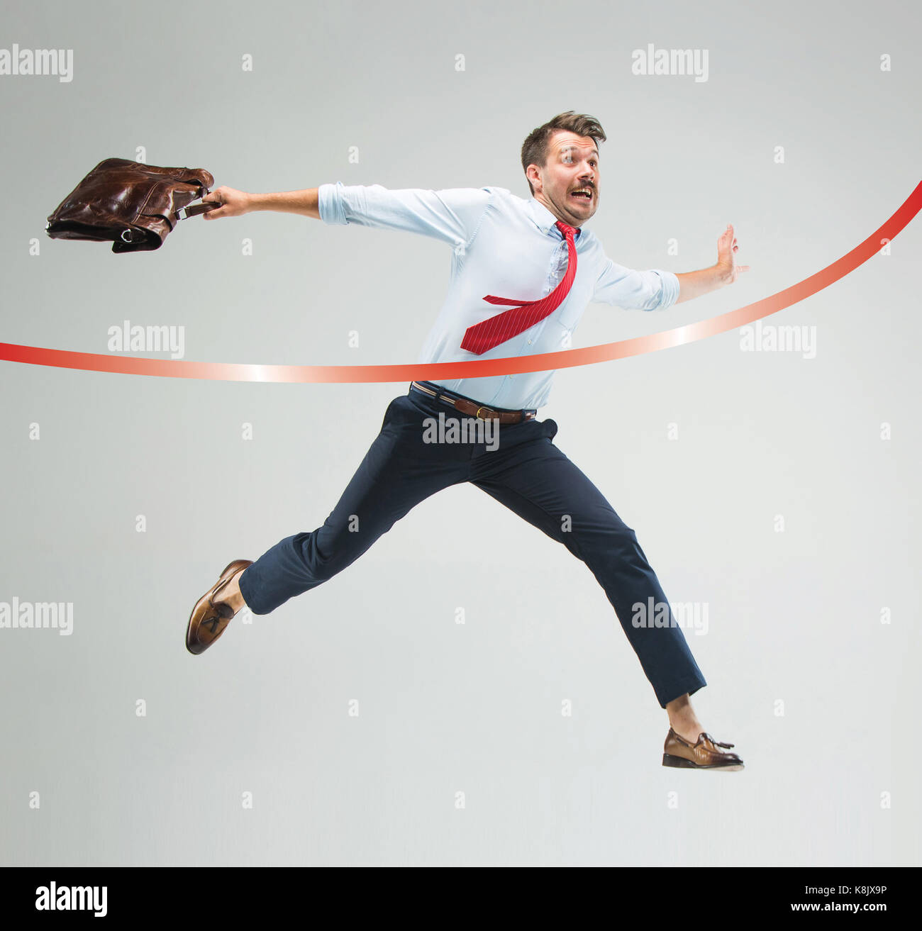 Concept of successful businessman in a finishing line Stock Photo - Alamy