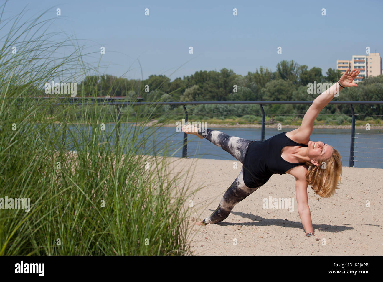 Woman doing outdoor workout in the city Stock Photo - Alamy