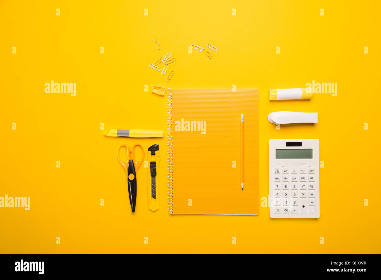 composition of yellow school supplies and calculator Stock Photo - Alamy