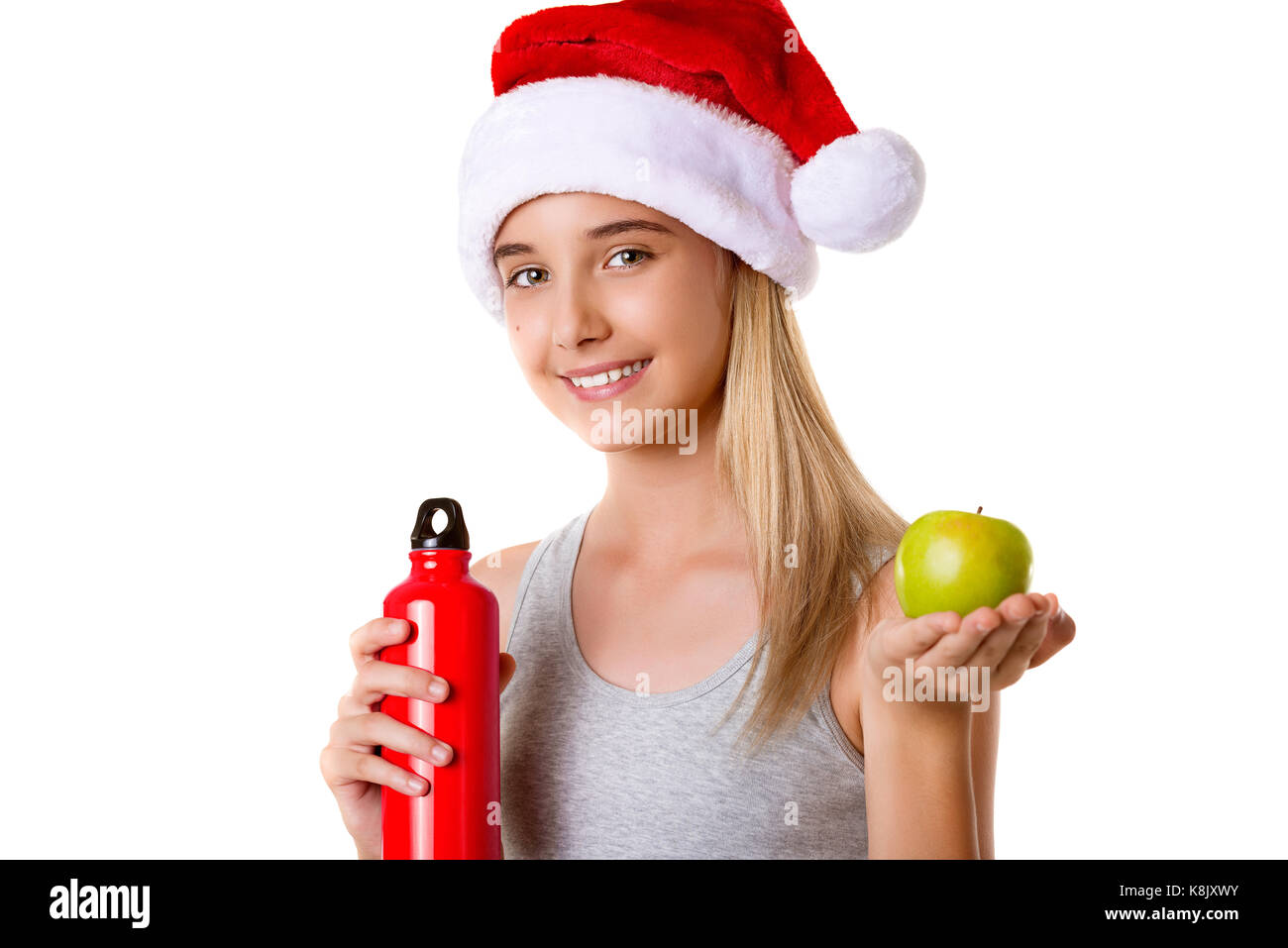 healthy fitness girl in Santa hat.Beautiful female model holding apple ...