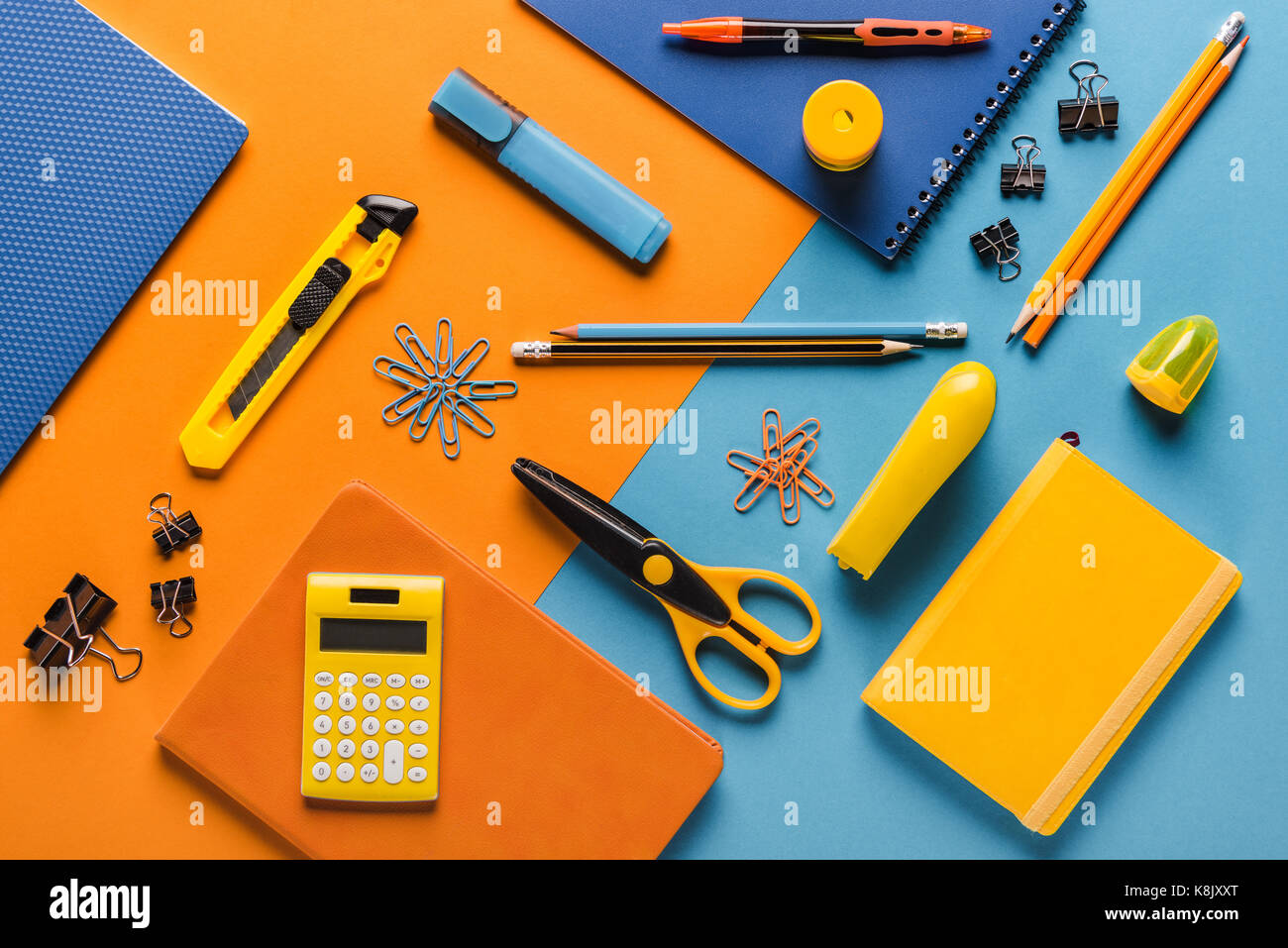 composition of yellow, orange and blue school supplies Stock Photo - Alamy