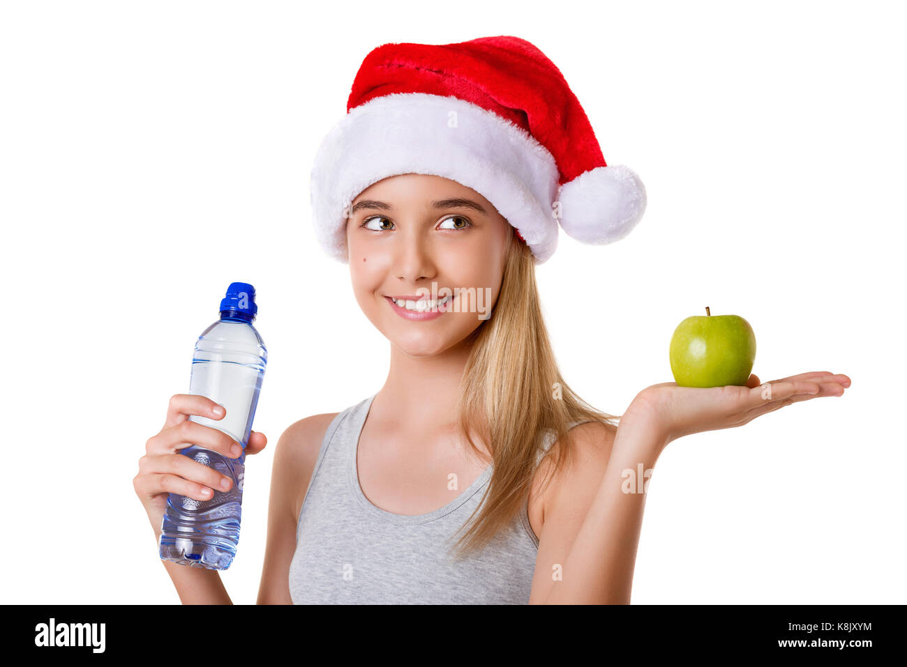healthy fitness girl in Santa hat.Beautiful female model holding apple ...