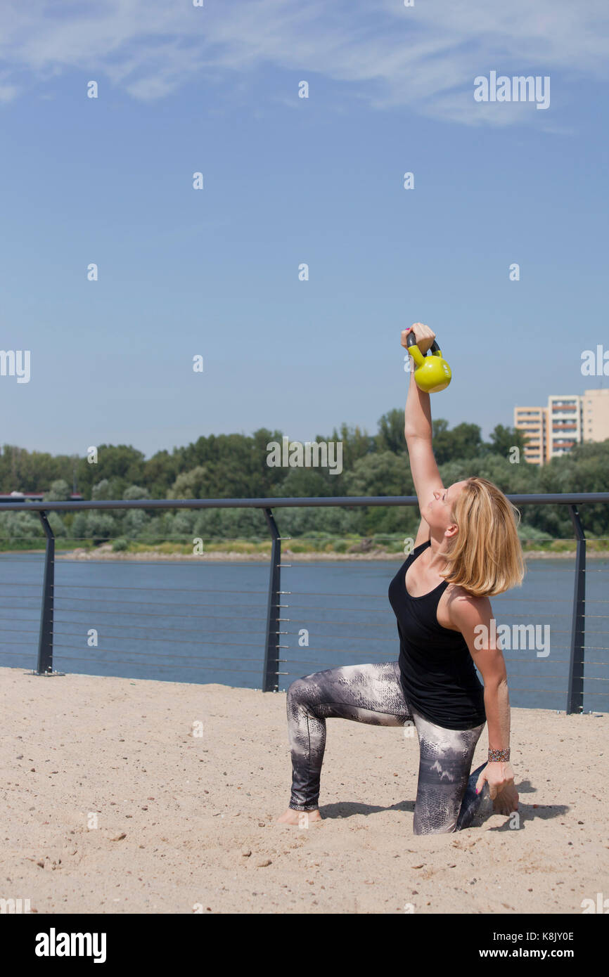 Woman doing outdoor workout in the city Stock Photo - Alamy
