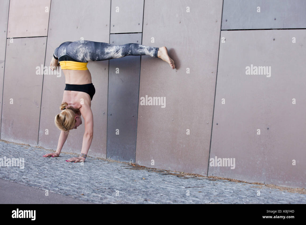 Woman doing outdoor workout in the city Stock Photo - Alamy