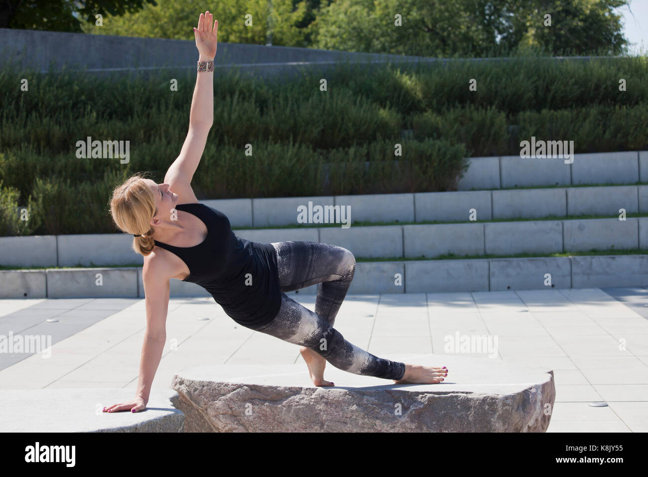 Woman doing outdoor workout in the city Stock Photo - Alamy