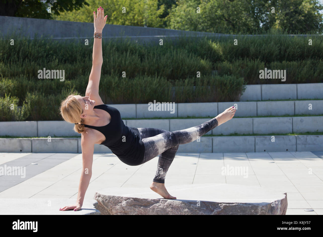 Woman doing outdoor workout in the city Stock Photo - Alamy