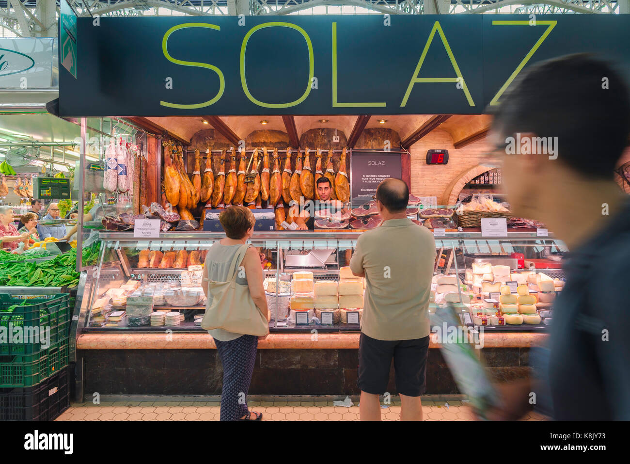 Valencia Spain market, view of people shopping at a delicatessen inside ...