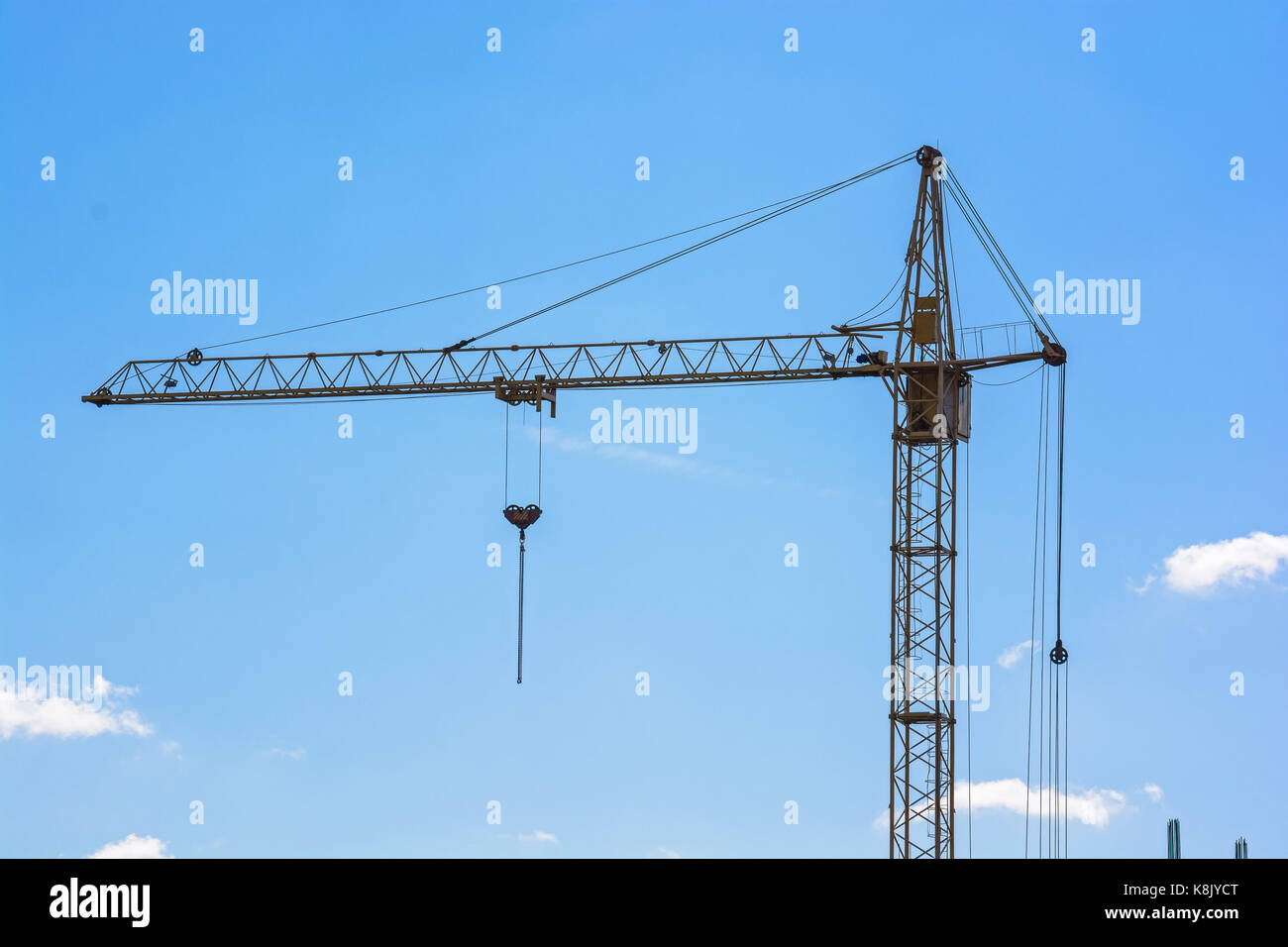 Construction crane builds new building Stock Photo - Alamy