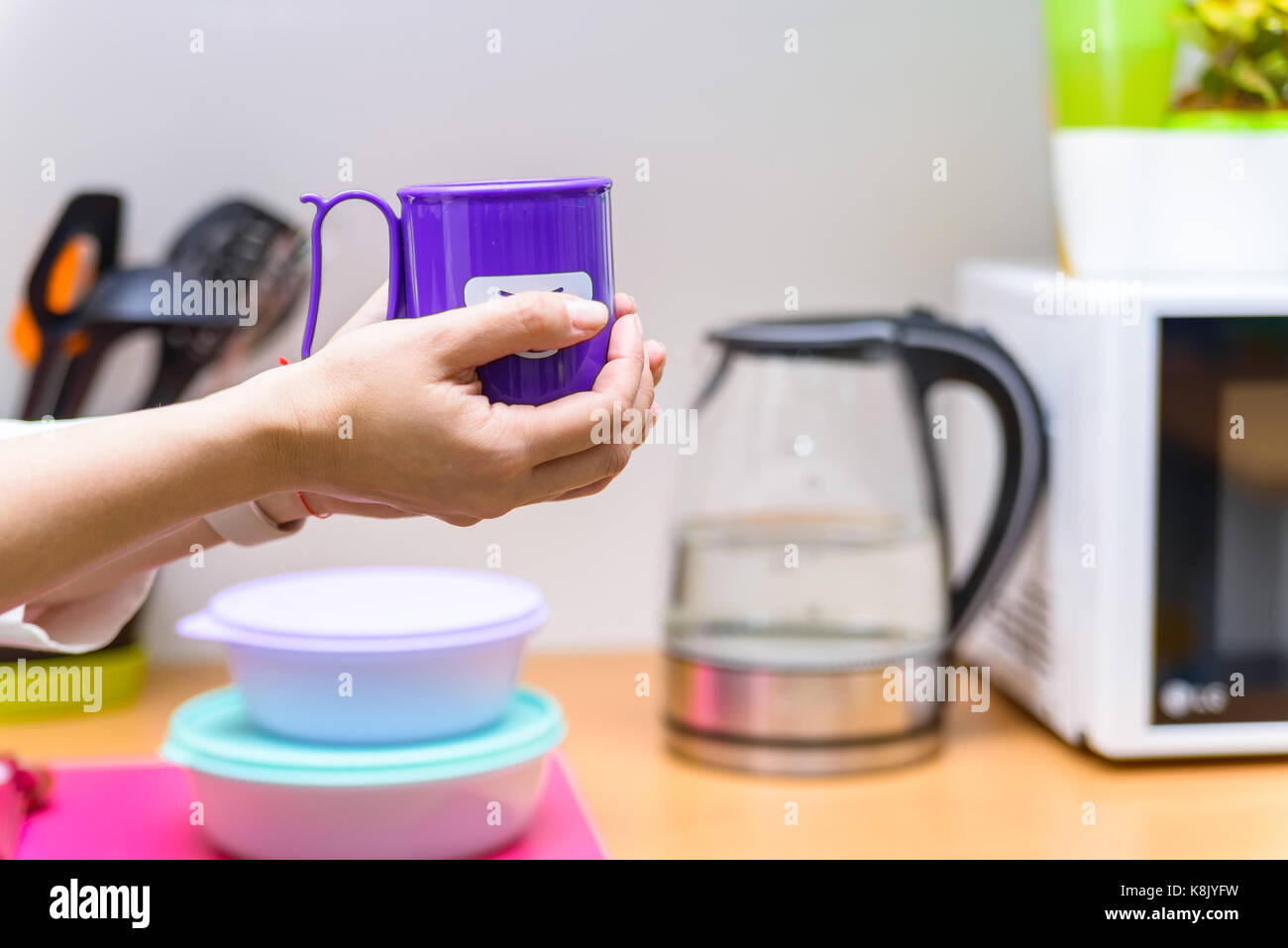 Hands hold plastic cup with smiling face Stock Photo - Alamy