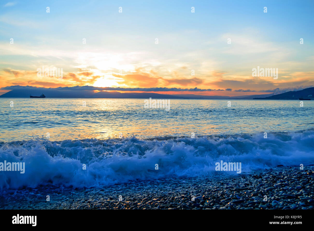 Sunset over sea Stock Photo - Alamy