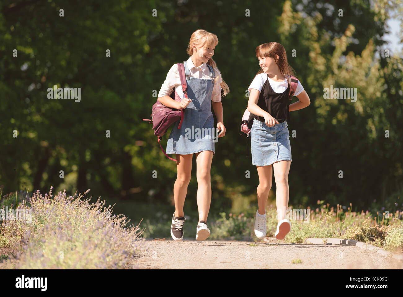 teenagers walking in park Stock Photo - Alamy